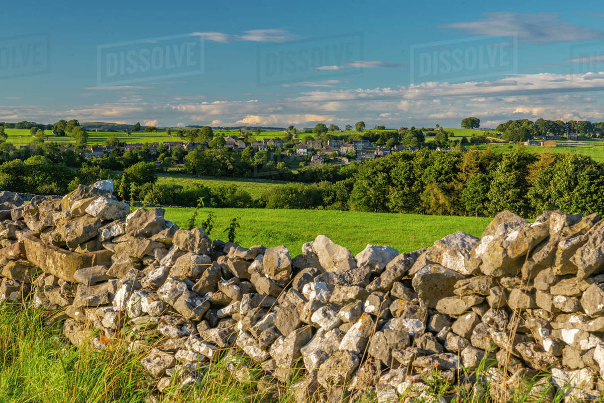 View of dry stone walls and Over Haddon village, Peak District National ...