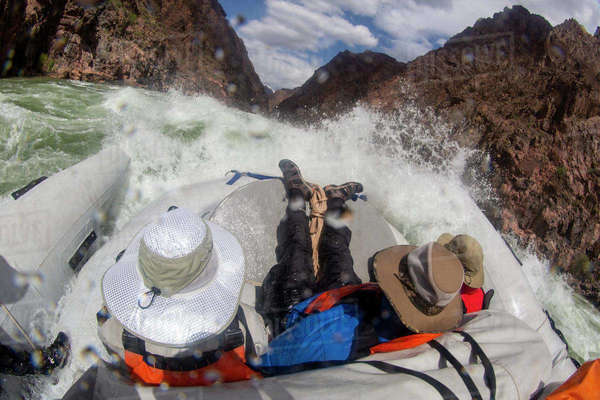 Shooting the rapids in a raft on the Colorado River, Grand Canyon ...