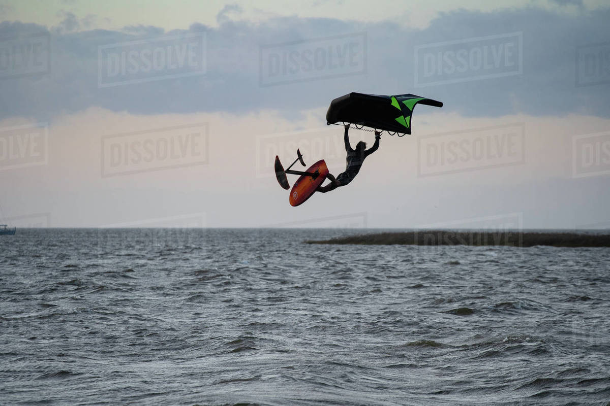 Pro surfer James Jenkins jumps his wing surfer over the Pamlico Sound ...