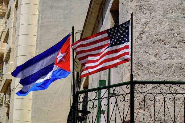 Cuban and American flags waving side by side, Old Havana, Cuba, West ...