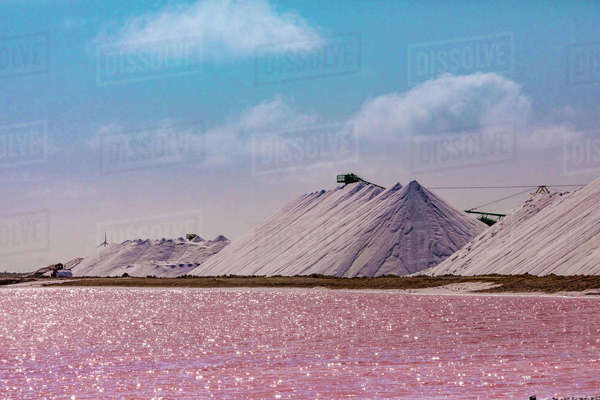 Pink colored ocean overlooking the Salt Pyramids of Bonaire ...