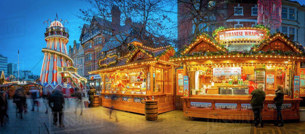 View of Christmas market stalls and helter skelter on Old Market Square ...