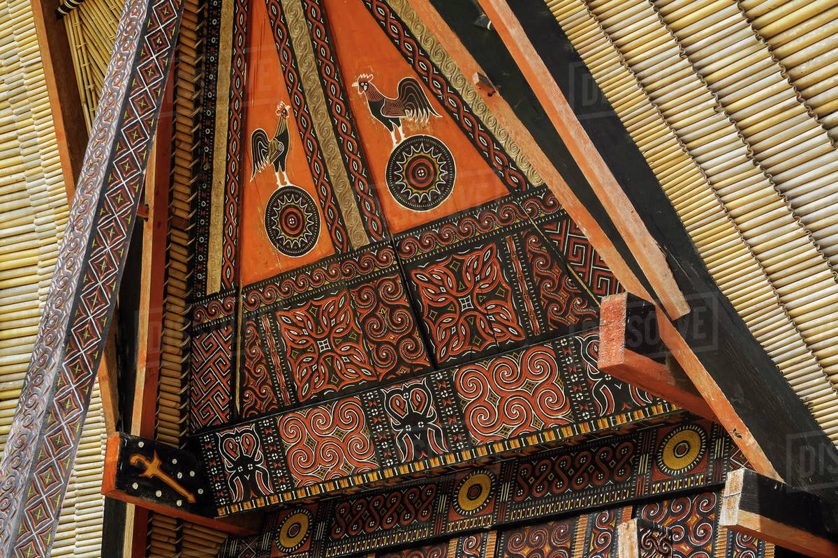 Tongkonan (rice barn) (house) with cockerel and sun motifs at a village ...