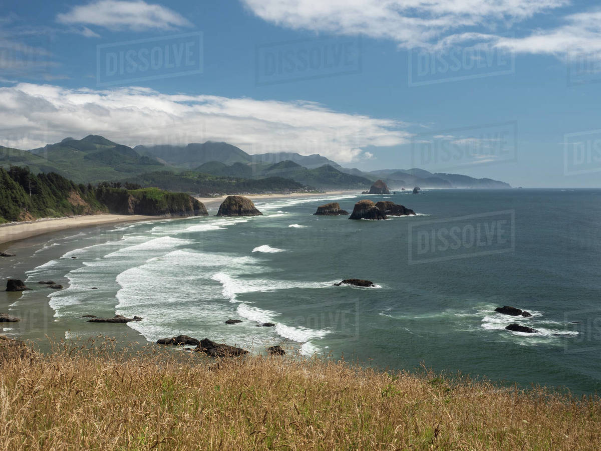 Crashing waves, mountains, and sea stacks in Ecola State Park on the ...
