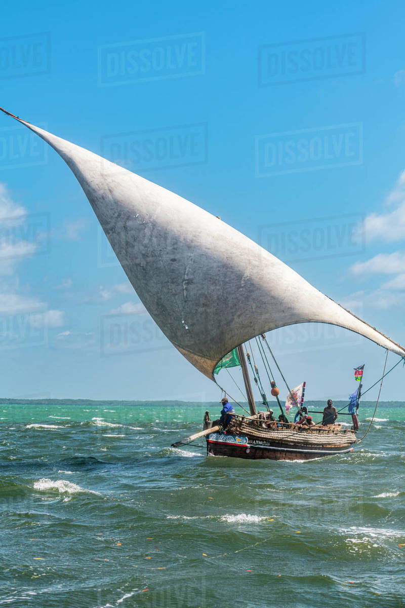 Traditional dhow sailing in the Indian Ocean, island of Lamu, Kenya ...