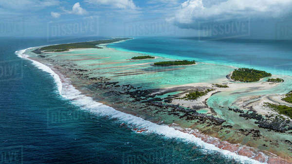 Aerial of the elevated reefs of Ile aux Recifs, Rangiroa atoll ...