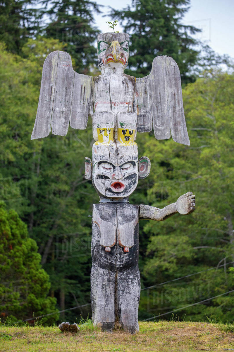 Kwakwaka'wakw totem poles in the cemetery in Alert Bay, Cormorant ...