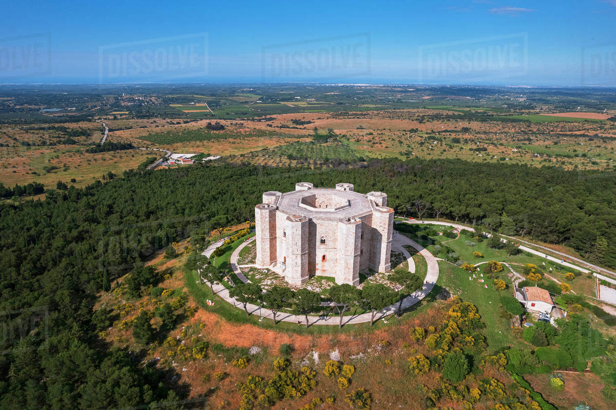Aerial view of the white octagonal castle of Castel del Monte rising in ...
