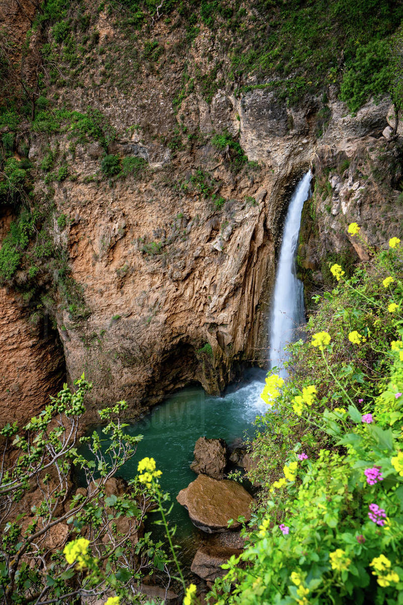 Waterfall near historic bridge of Ronda in Pueblos Blancos region ...