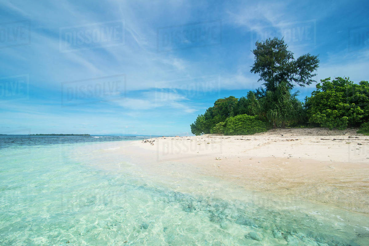 Turquoise water and white sand beach at the stunning little island of ...