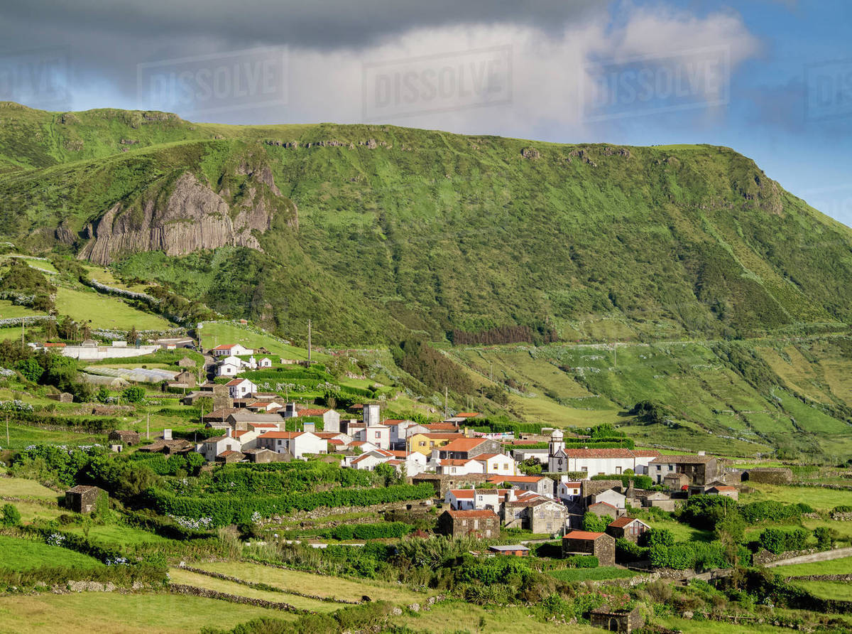 View towards Mosteiro Village and Rocha dos Bordoes, Flores Island ...