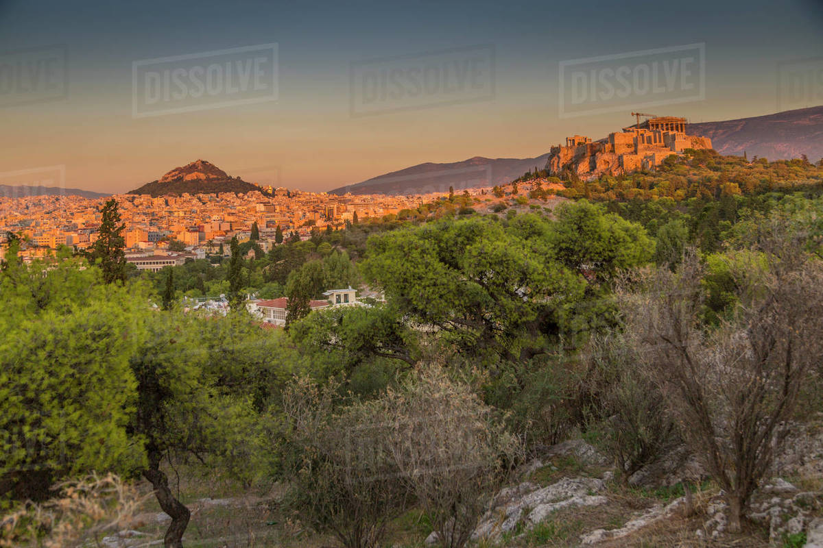 View of The Acropolis and Likavitos Hill at sunset from Filopappou Hill, Athens, Greece, Europe ...