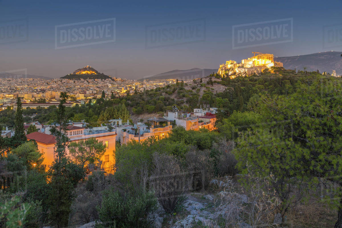 View of The Acropolis and Likavitos Hill at dusk from Filopappou Hill ...
