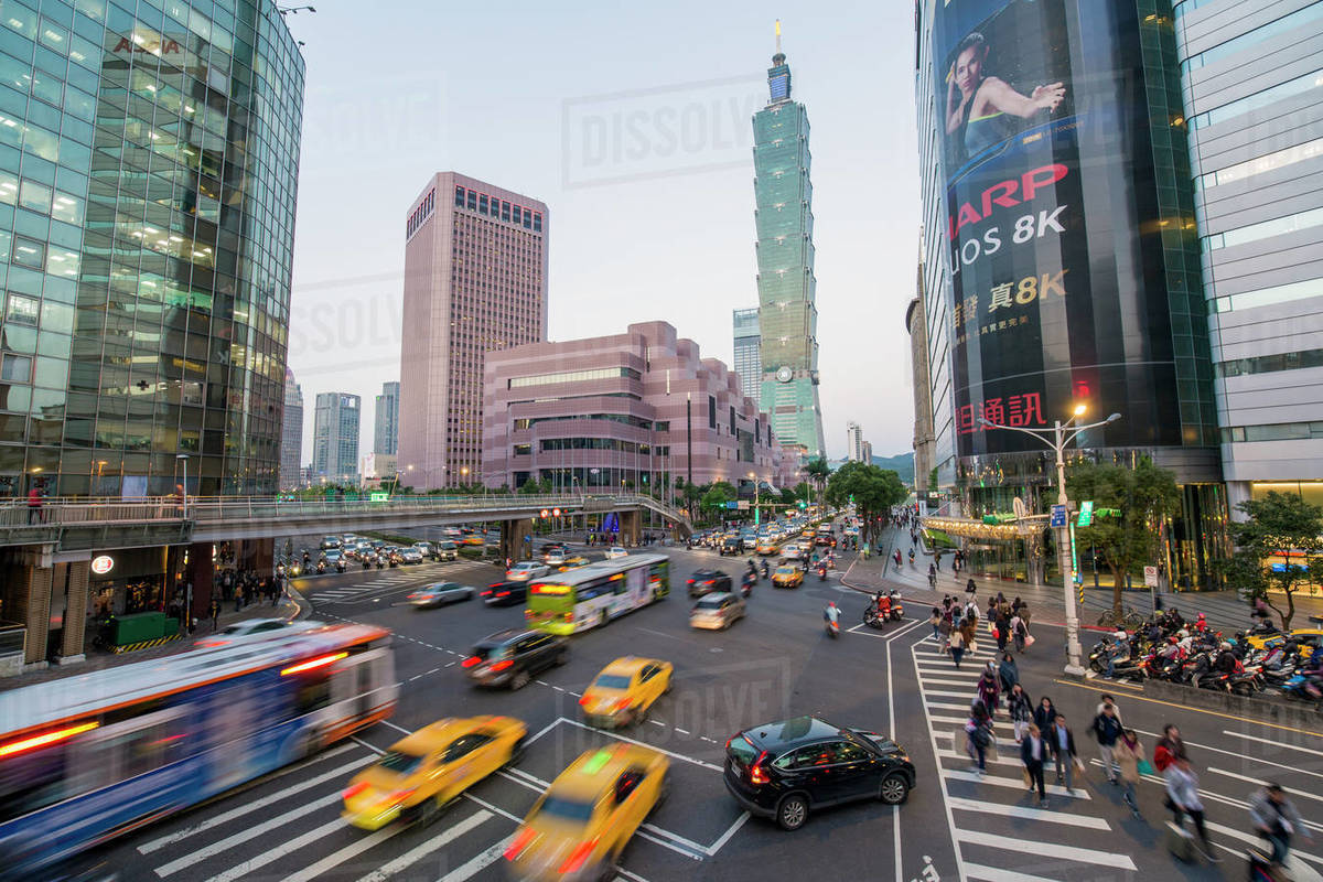 Traffic in front of Taipei 101 at a busy downtown intersection in the ...