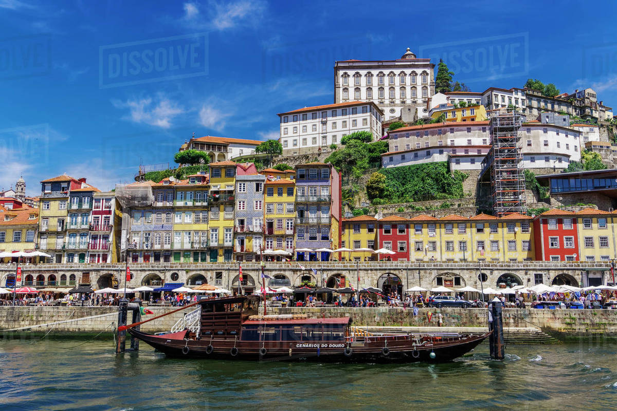 Traditional waterfront houses in the Ribeira district and boat on the ...