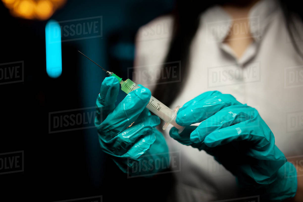 injecting injection vaccine vaccination flu doctor. - Stock Photo ...