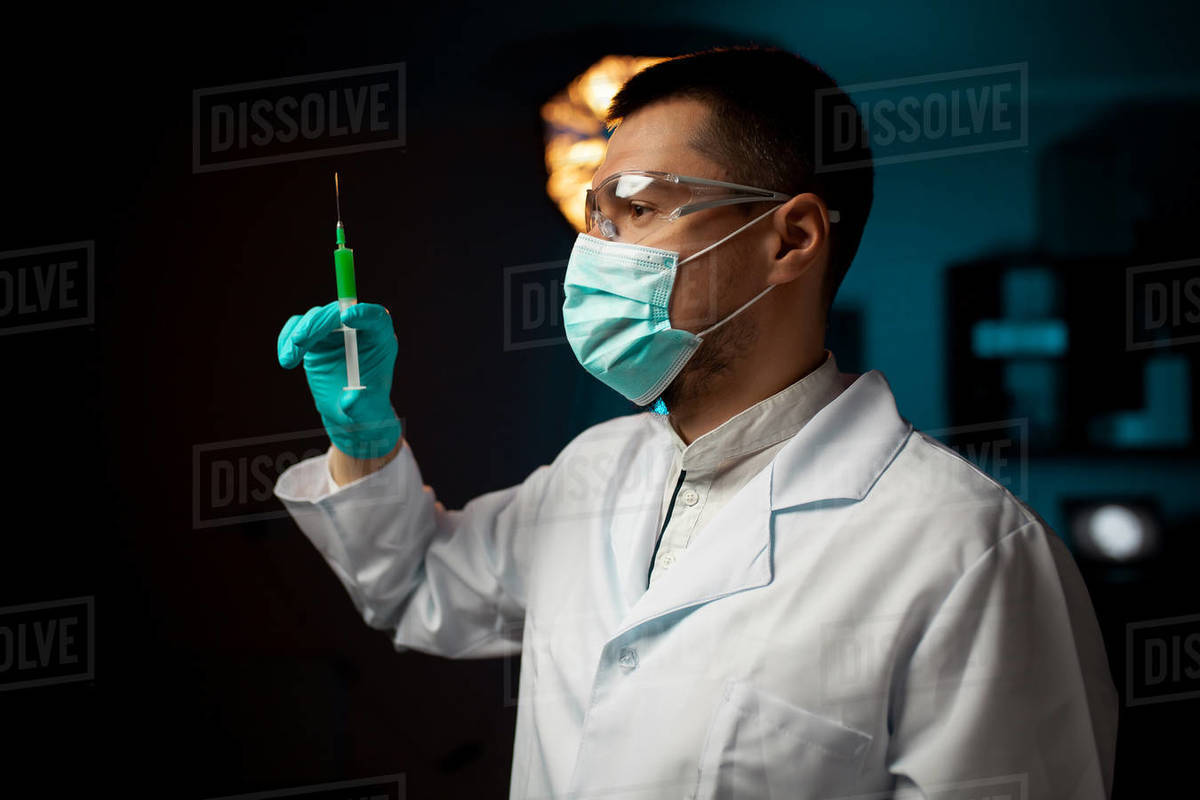 Doctor, researcher or scientist hand in blue glove holding flu, measles ...