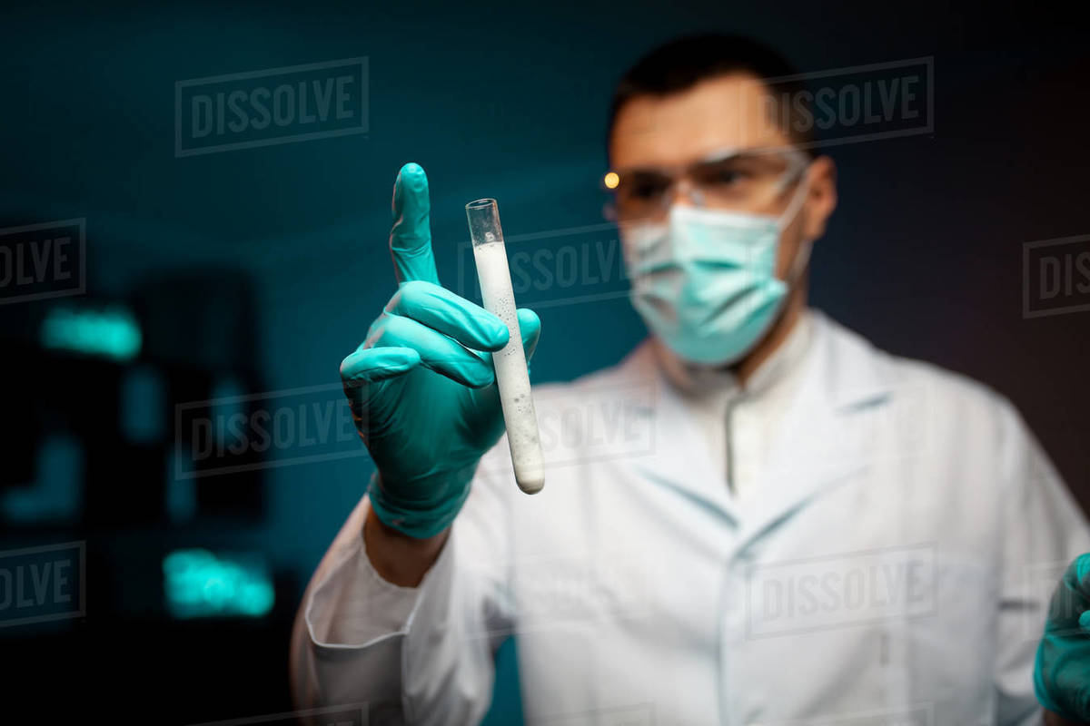 A scientist is doing his chemical lab research. Selective focus ...