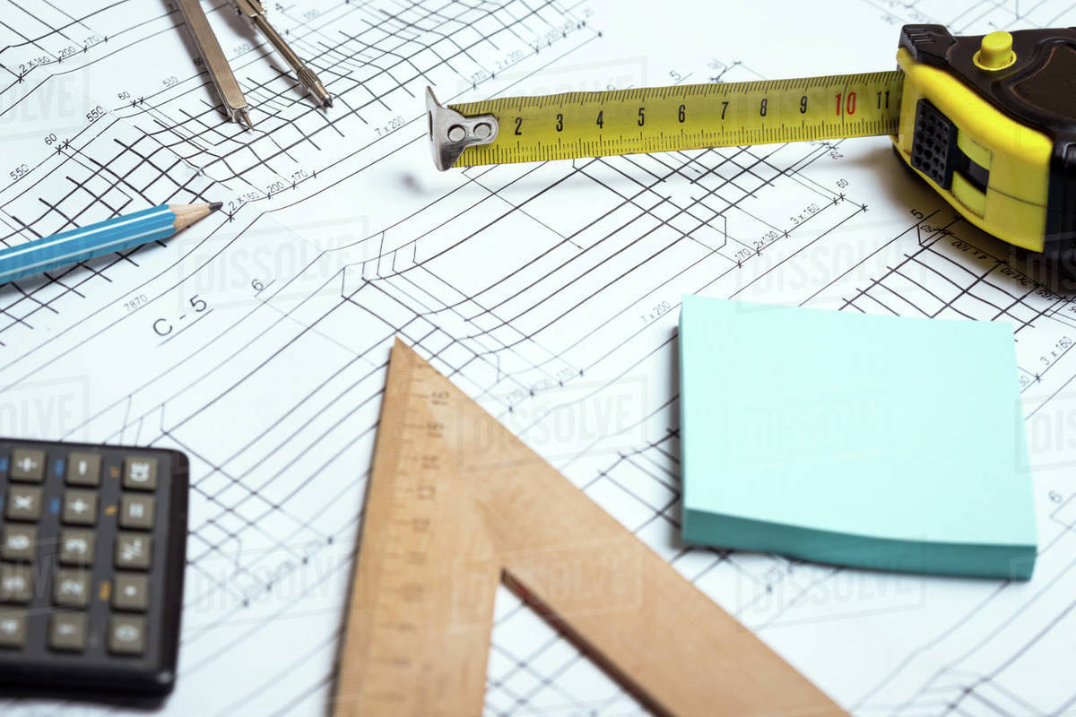 Engineering and design. drawing and calculator, tape measure, ruler on ...