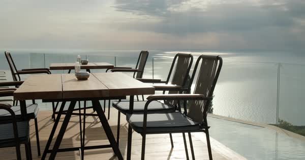 Luxury restaurant exterior with pool and panoramic view from the hills ...