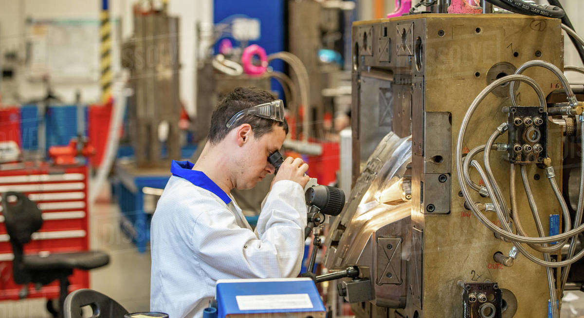 smooth accurate work in the factory under microscope. - Stock Photo ...