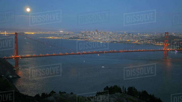 a super full moon rises over golden gate bridge in san francisco ...
