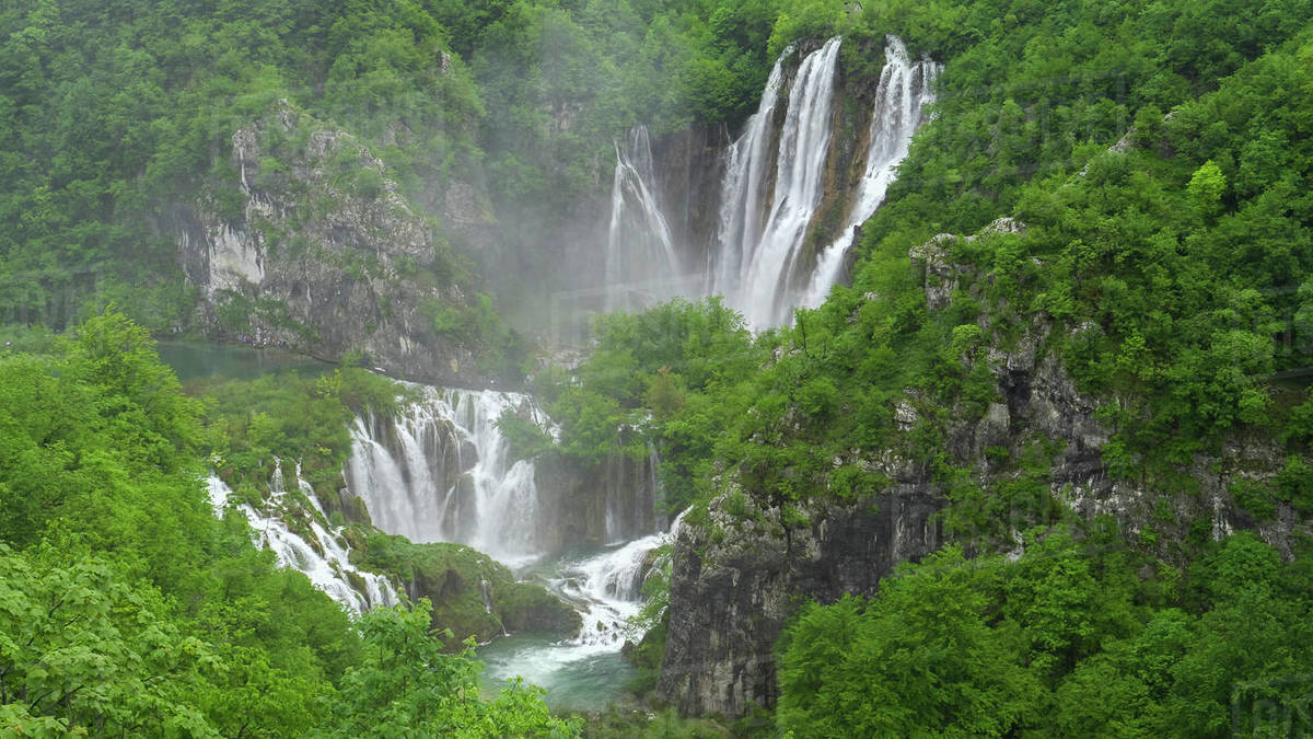 veliki slap, the largest waterfall at plitvice, at on a rainy misty day ...