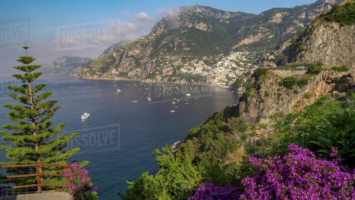 long shot of the town of positano on a summer morning at the amalfi ...