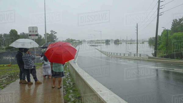 WINDSOR, AUSTRALIA - MAR, 23, 2021: onlookers watch flood water from ...