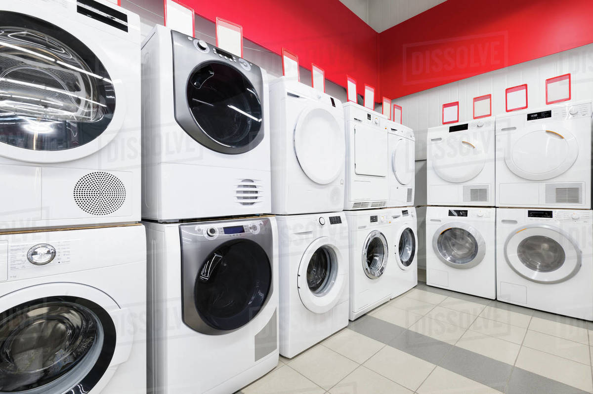 Row of washing machines in appliance store - Stock Photo - Dissolve