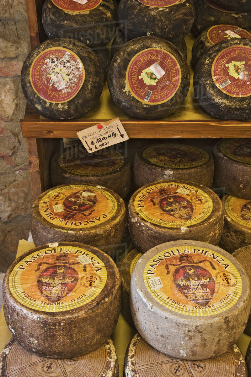 Italy, Tuscany, Pienza. An assortment of Italian cheese in a shop ...