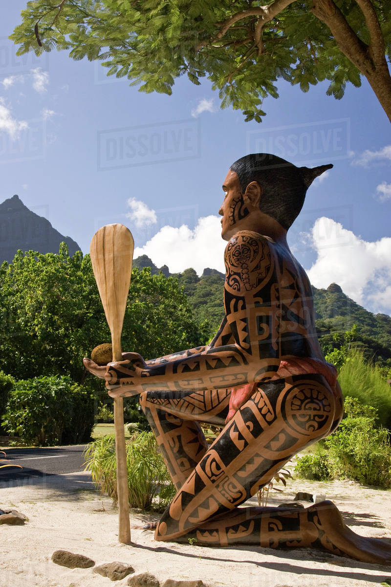 French Polynesia, Moorea. Side view of statue of Taaroa warrior at ...