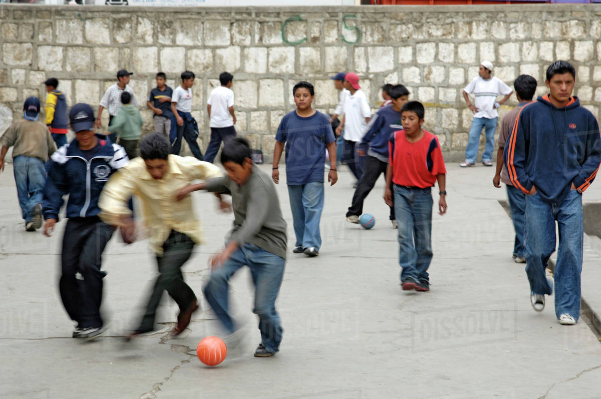 Guatemala, Zunil, Boys playing soccer in courtyard. - Royalty-free ...