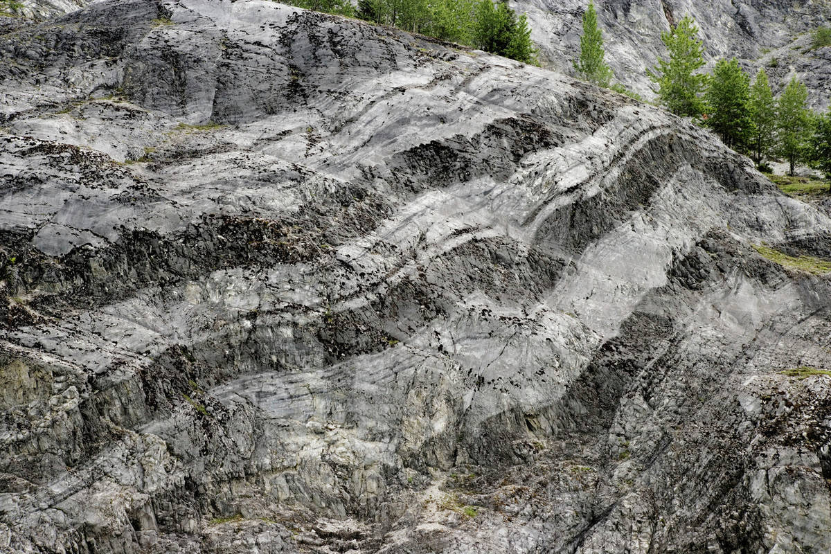 USA, Alaska, Glacier Bay National Park. Limestone cliffs with bands of ...