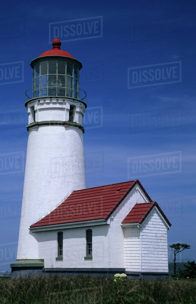 Oregon, Oregon Coast, Cape Blanco lighthouse, towers above the ...