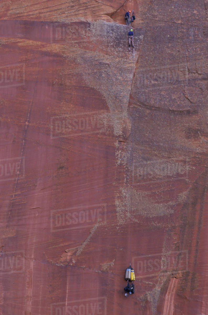 NA, USA, Utah, Zion National Park. Climbers on Angels landing wall ...