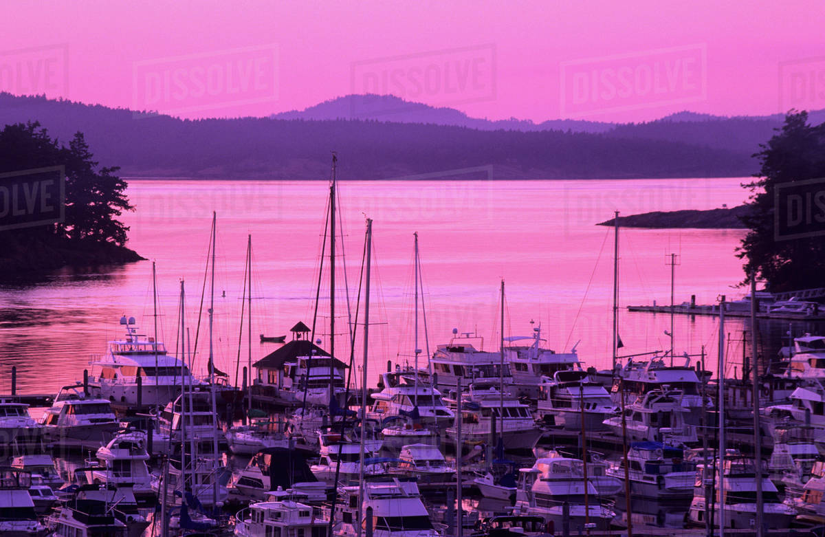 WA, San Juan Island, Roche Harbor Resort, Roche Harbor marina at sunset ...