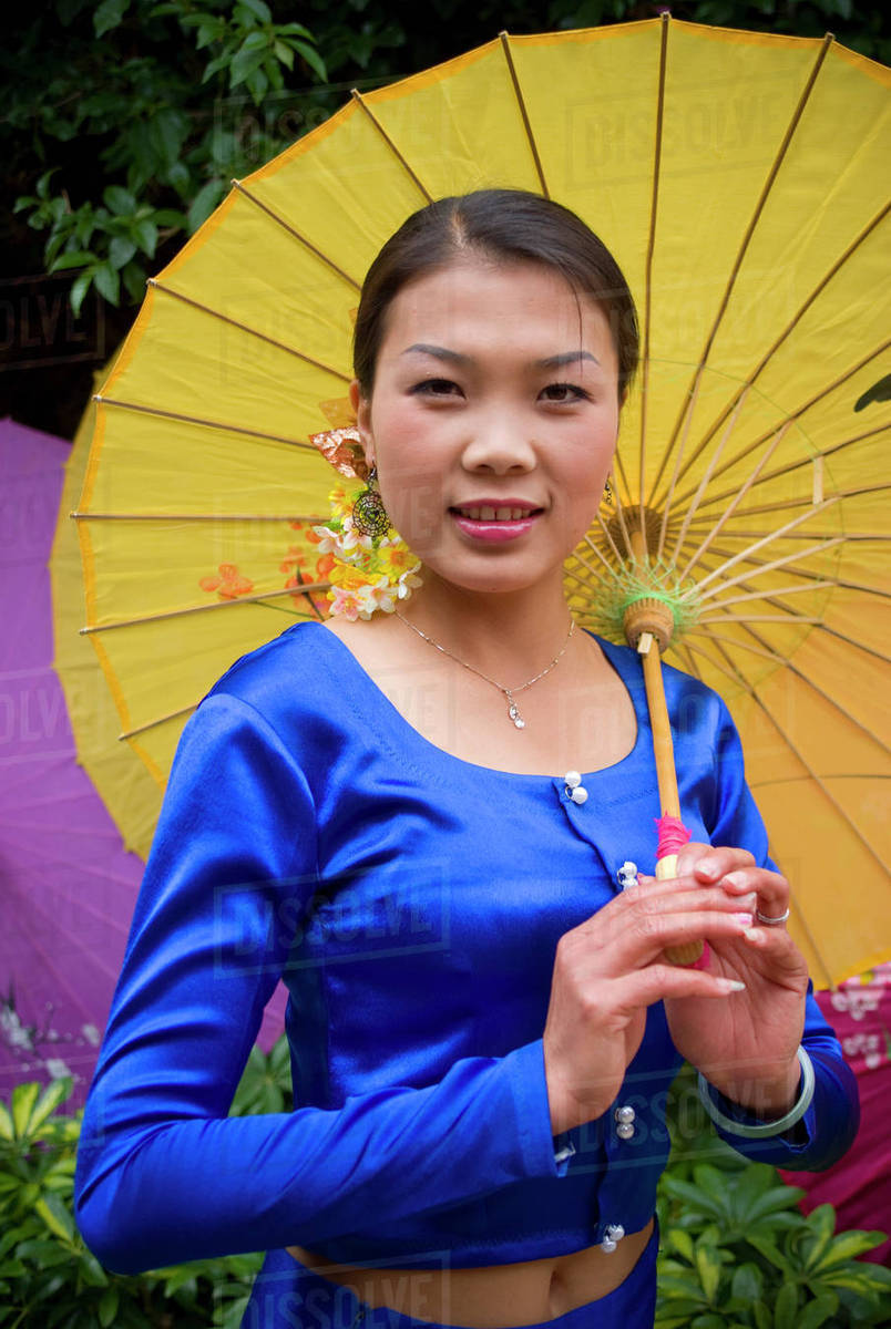 Asia, China, Yunnan Province. Young Dai minority woman in traditional ...