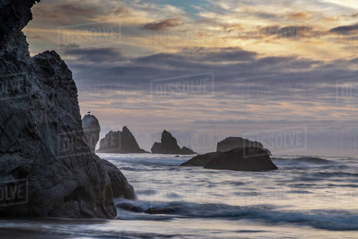 USA, Oregon, Bandon Beach. Pacific Ocean sea stacks at sunset ...