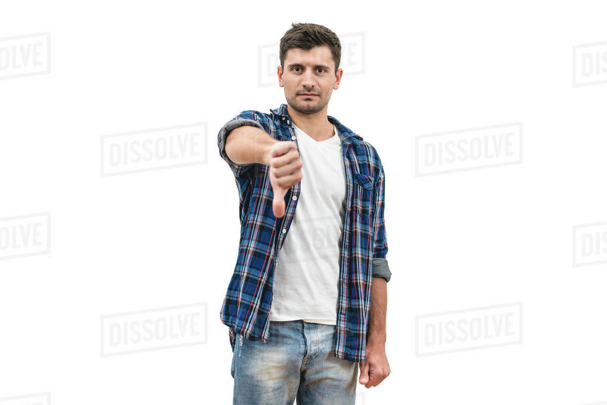The man thumbs down on the white background - Stock Photo - Dissolve