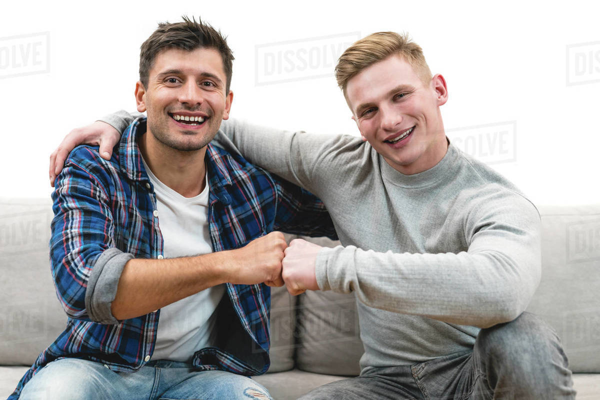 The two happy men greeting on the white background - Stock Photo - Dissolve