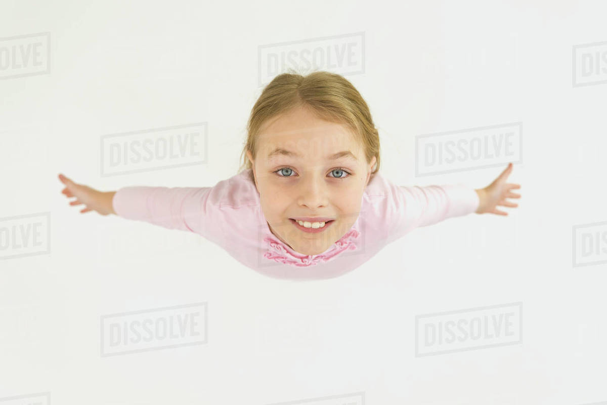 The happy girl stand and look to the camera. View from above - Royalty ...