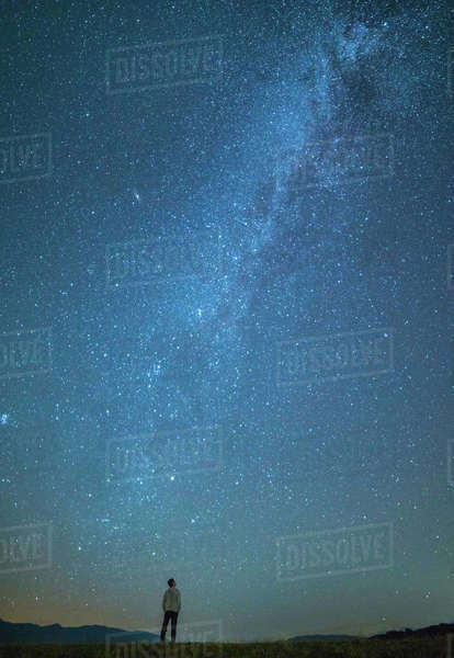 The man stand on the background of the stars. night time - Royalty-free ...