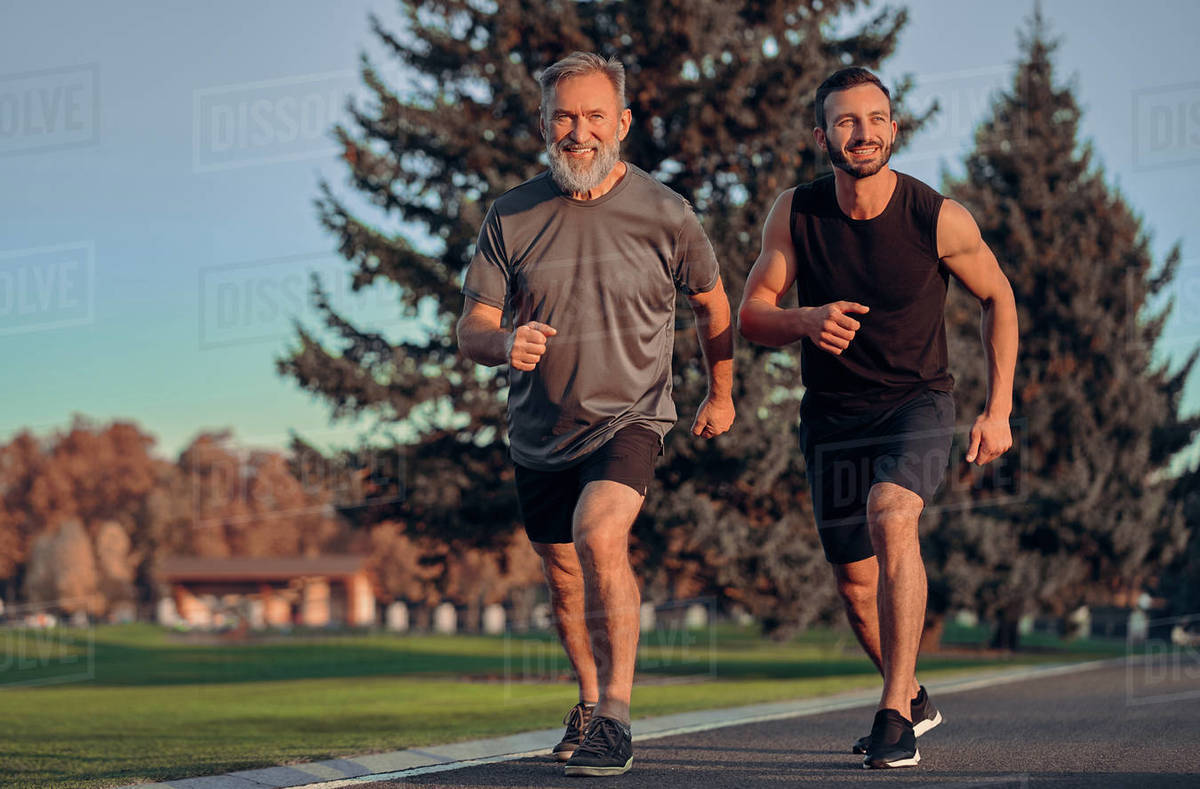 The happy father and son running on the road - Royalty-free Stock Photo ...