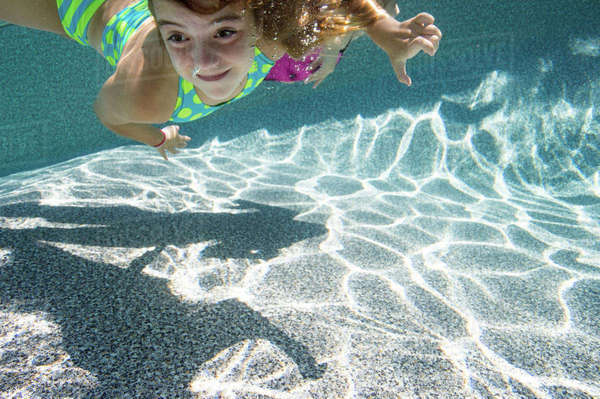 Girls swimming in pool - Royalty-free Stock Photo | Dissolve