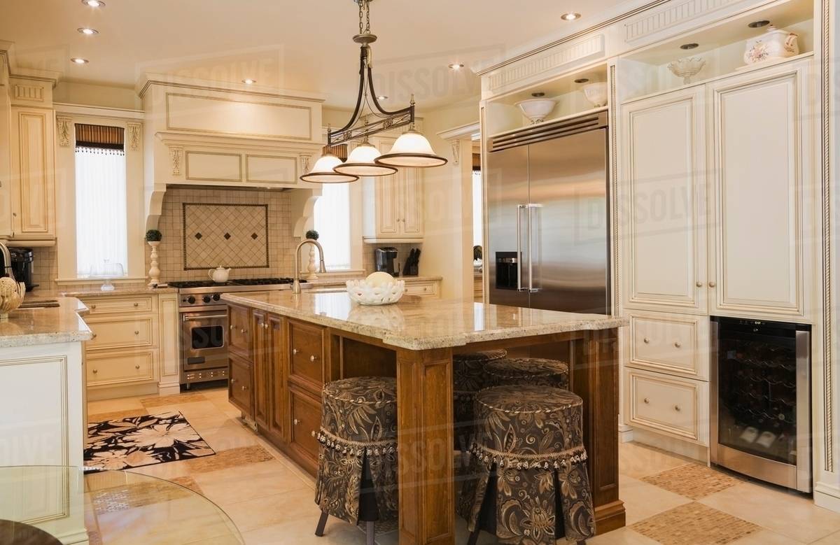 Traditionally styled kitchen with tiled floor - Stock Photo - Dissolve