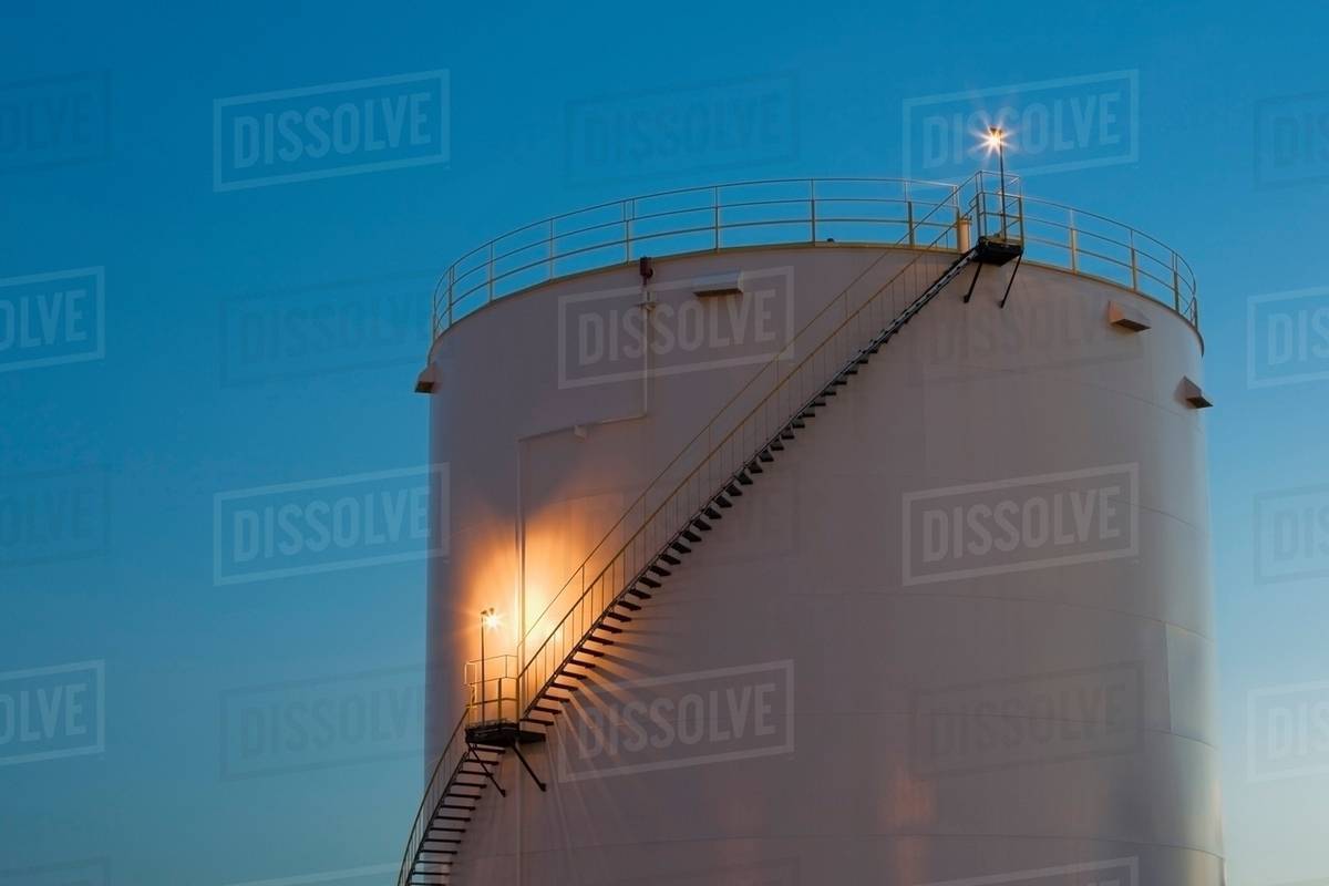 Gas storage tank at dusk, Montreal, Quebec, Canada - Stock Photo - Dissolve
