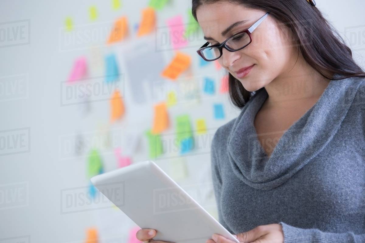 Portrait of female office worker holding file - Royalty-free Stock ...