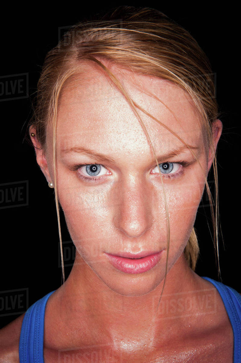 Close up of womans sweaty face - Royalty-free Stock Photo | Dissolve