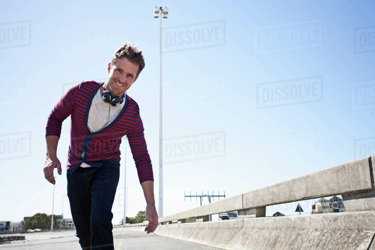Man walking on city street - Royalty-free Stock Photo | Dissolve